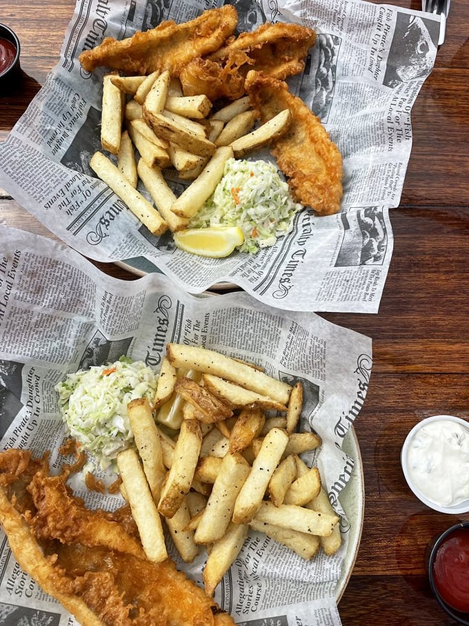 Fish and chips served on faux newspaper—a nod to tradition that says, "We respect the classics, but we're not getting actual newsprint on your food."