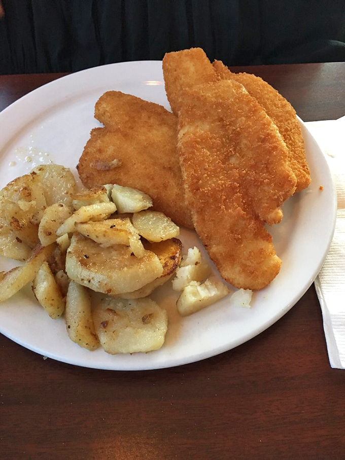 Golden-fried perfection alongside seasoned potatoes—proof that simple food executed flawlessly beats fancy cuisine any day of the week.