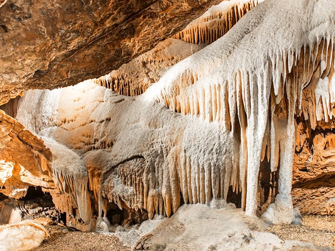 Like frozen waterfalls caught mid-cascade, these flowing stone formations remind us that even rock can move—just on a timeline we humans rarely witness.