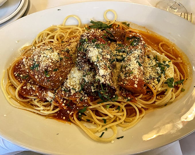 Spaghetti that's dressed better than most people at the opera – hearty meatballs and rich sauce conducting a flavor symphony on perfectly cooked pasta.