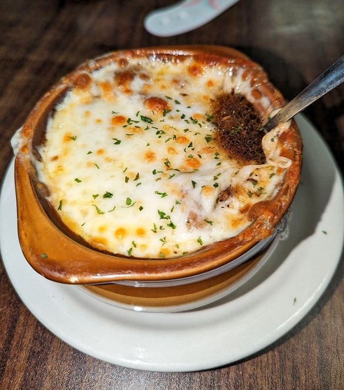 French onion soup with a cheese pull worthy of an Olympic medal. Comfort in a crock that warms you from the inside out.