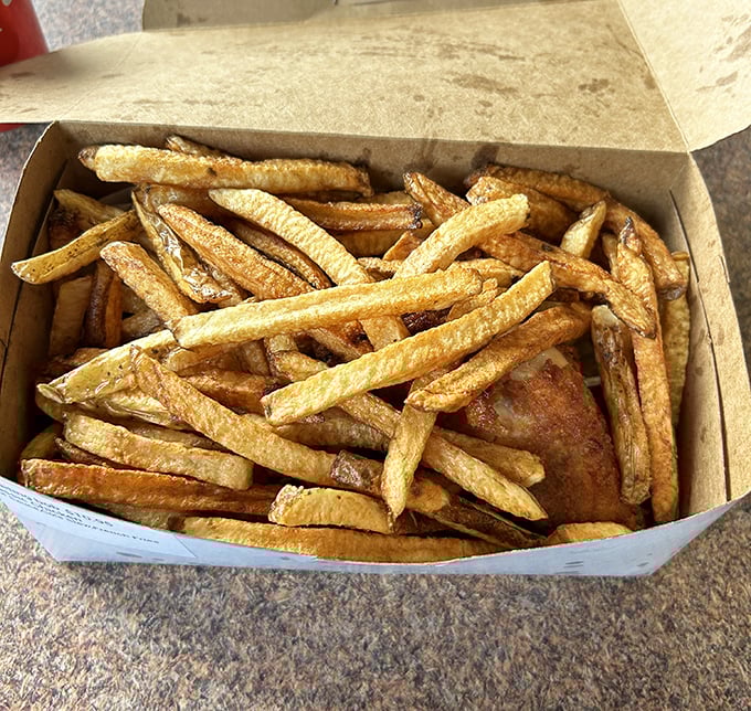 These aren't just french fries—they're supporting actors in the chicken show, ready to soak up every last drop of that legendary sauce.