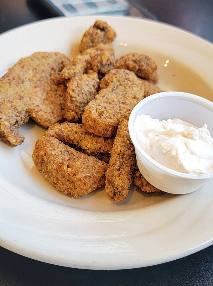 Crispy on the outside, tender within—these fried mushrooms aren't trying to reinvent the wheel, just perfect it. The dipping sauce is merely a bonus to an already complete package.