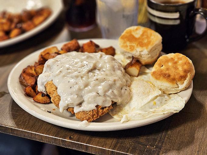 Country fried steak smothered in gravy with eggs and biscuits—the breakfast equivalent of a warm hug from your favorite aunt.
