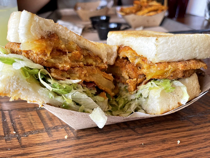 This isn't just a sandwich—it's architecture. Crispy fried goodness layered with fresh lettuce, creating the perfect textural symphony in every bite.