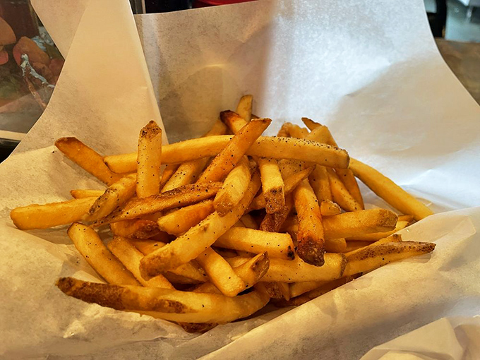 These aren't just french fries—they're potato perfection sticks with the ideal balance of exterior crispness and fluffy interior. Worth every calorie.