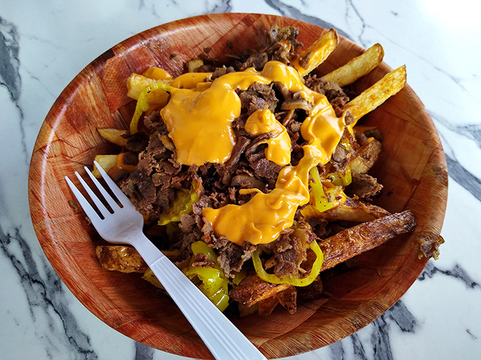 Cheese fries with what appears to be Philly steak—proof that even landlubbers get the royal treatment at this seafood sanctuary.