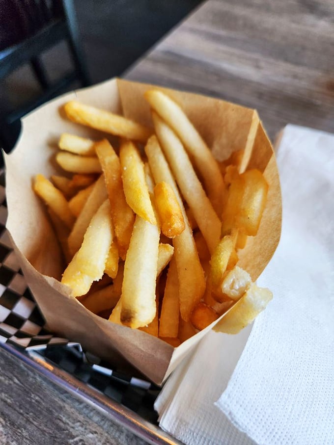 French fries that achieve the golden trifecta: crispy exterior, fluffy interior, and just enough salt to make you reach for "just one more."