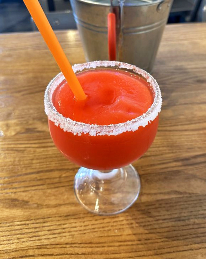 That salt-rimmed frozen margarita isn't just a drink—it's the perfect cool companion for spice-laden seafood. Like finding an oasis in a desert of heat.