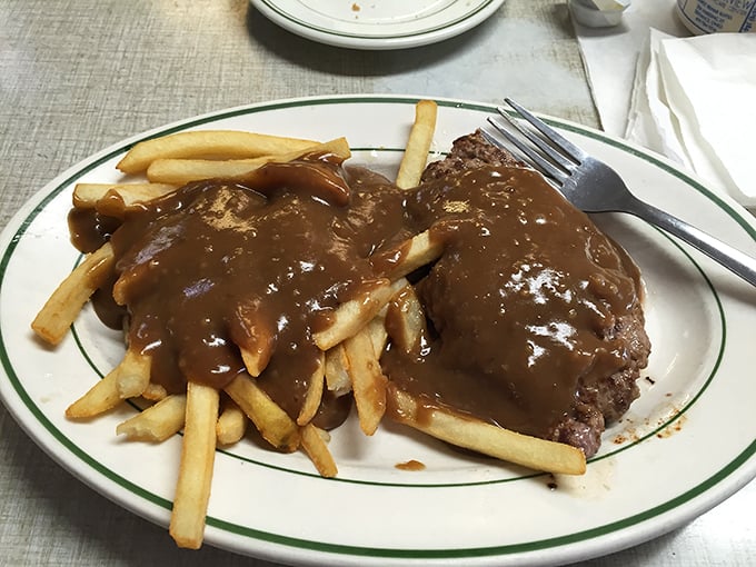Gravy isn't just a condiment here—it's practically a love language, speaking volumes over this hearty hamburger steak.