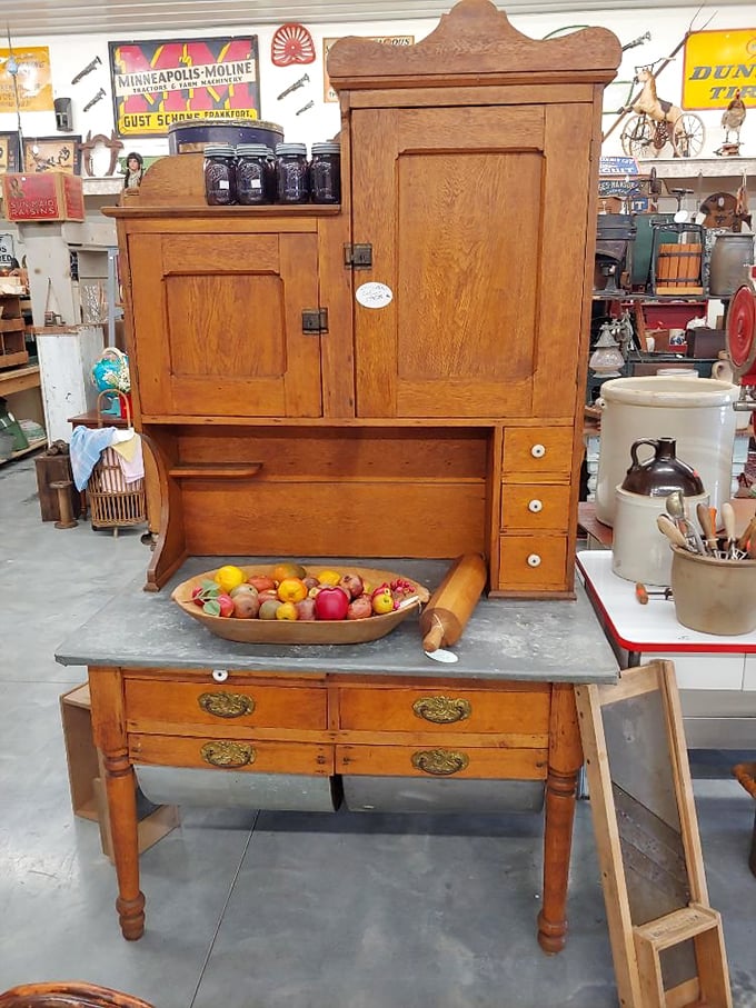 The Hoosier cabinet—kitchen command center of yesteryear! Before built-ins and islands, this oak beauty organized everything from flour sifting to rolling pins.