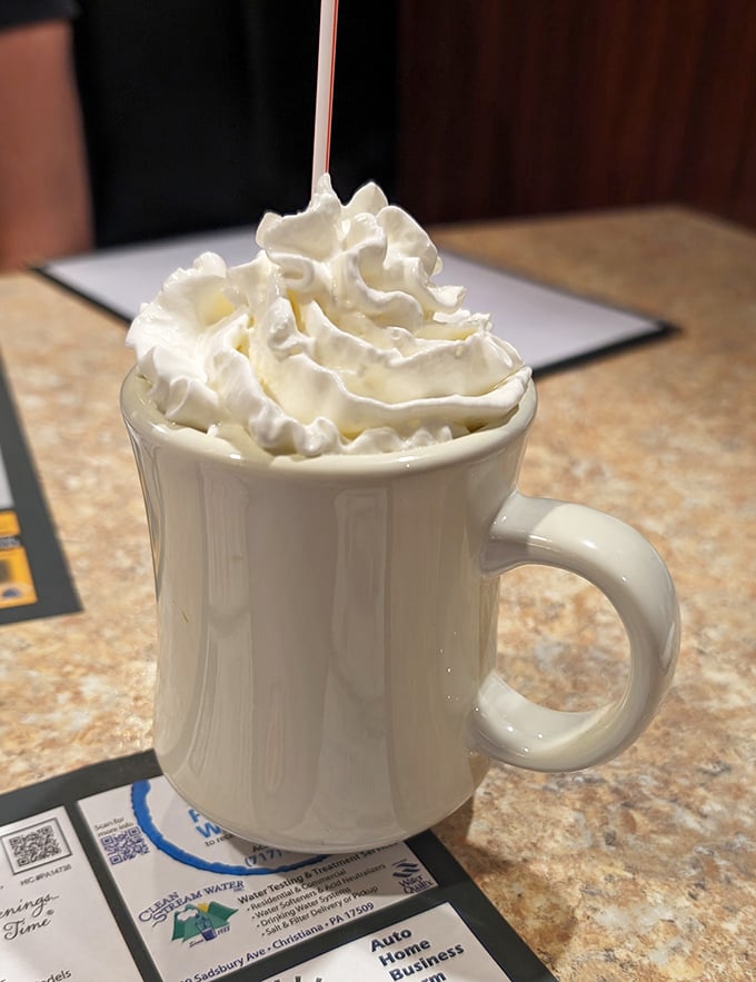 Hot chocolate that doesn't just have whipped cream—it has a whipped cream hat worthy of the Kentucky Derby.