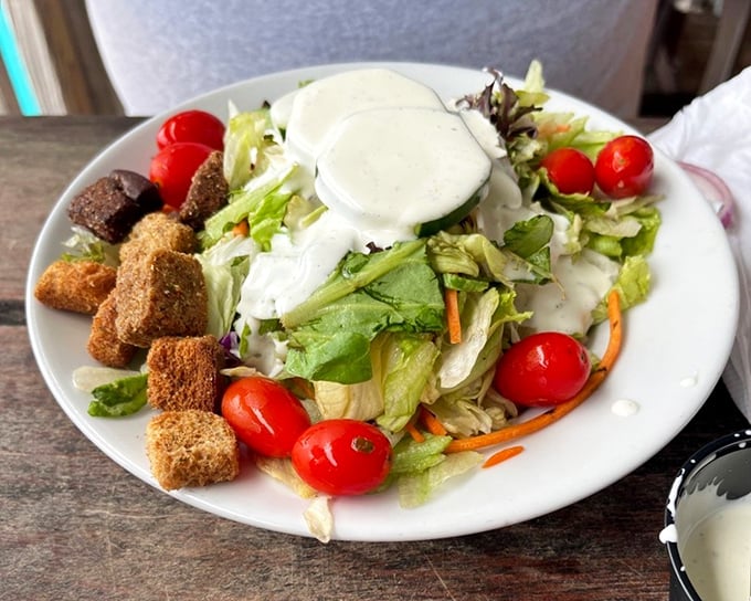 A garden-fresh salad with crunchy croutons – because sometimes you need something green before diving back into seafood paradise. Balance, people!