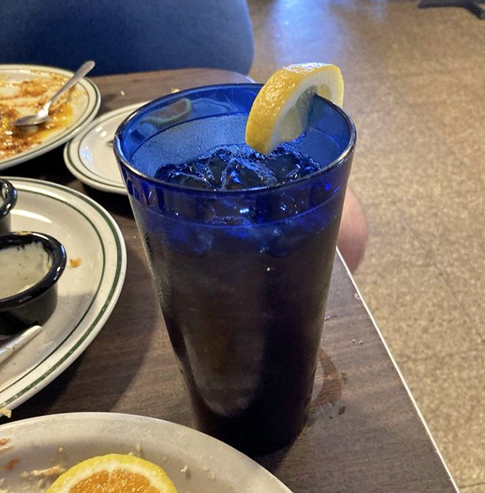 That cobalt blue glass isn't just serving iced tea—it's delivering liquid refreshment with Southern hospitality in every sip.