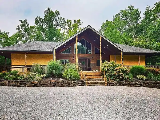 This rustic cabin blends so seamlessly with its surroundings, Mother Nature probably checks the deed occasionally just to make sure.