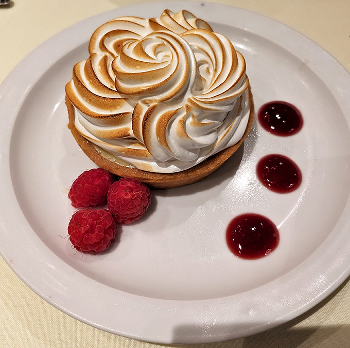 This isn't just dessert—it's architecture. Toasted meringue peaks shelter a tangy key lime filling, proving that Delaware knows its way around Florida's signature sweet.