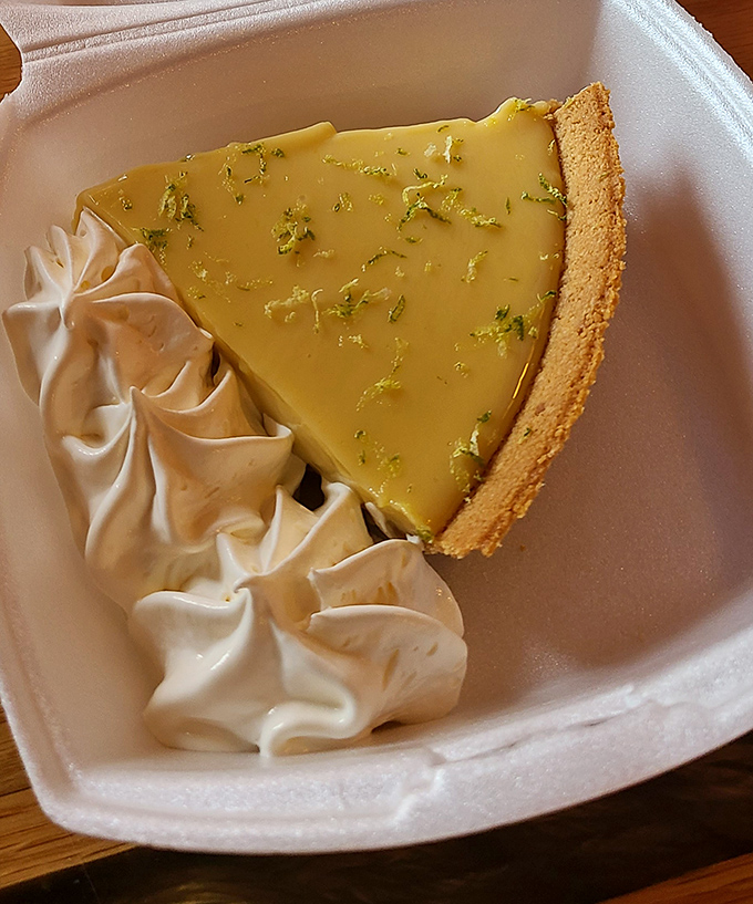 Key lime pie that strikes the perfect balance between tart and sweet. That dollop of whipped cream isn't optional—it's essential diplomacy.