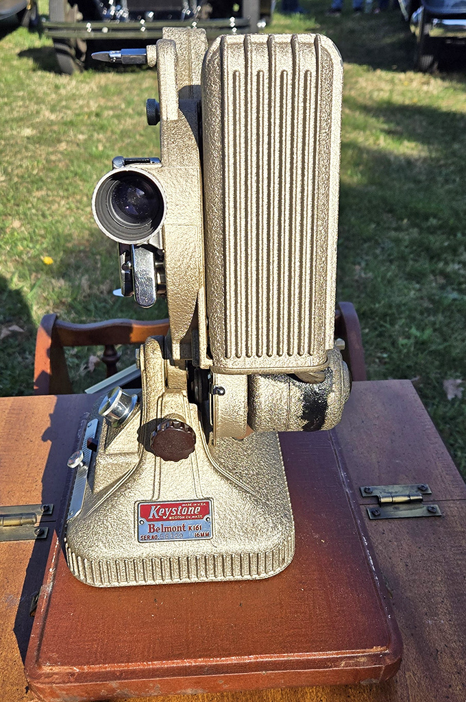 This golden Keystone Belmont projector once brought celluloid dreams to life—now a beautiful relic of cinema's mechanical age.