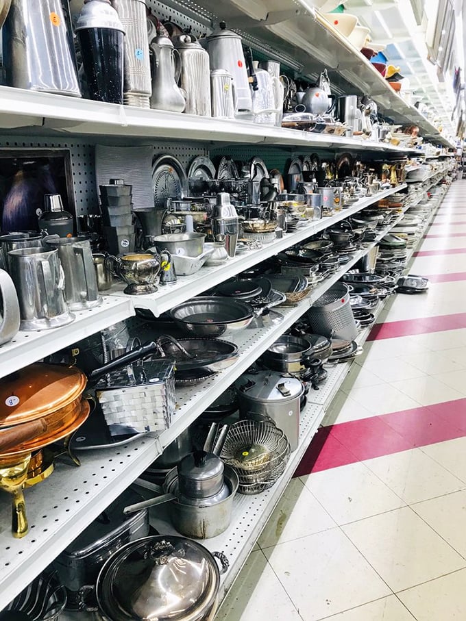 Kitchen implements spanning decades stand at attention. That copper-bottom pot probably cooked meals for three generations before arriving here.
