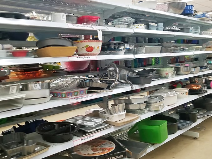Kitchenware paradise where cast iron pans with decades of seasoning sit alongside barely-used wedding registry items from abandoned cooking phases.