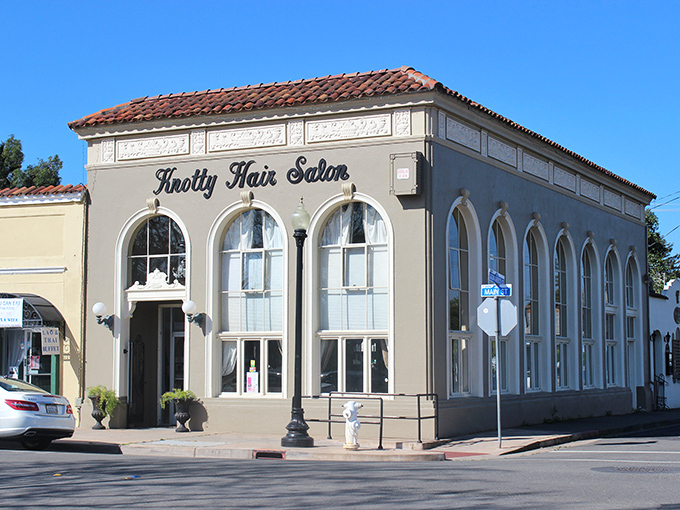 The Knotty Hair Salon's historic façade proves that sometimes the most beautiful transformations happen inside buildings that refuse to change. 