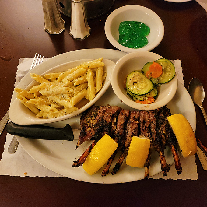 These lamb ribs aren't just dinner—they're a primal pleasure with a side of civilization. The pasta and vegetables provide balance, but we know why you're really here.
