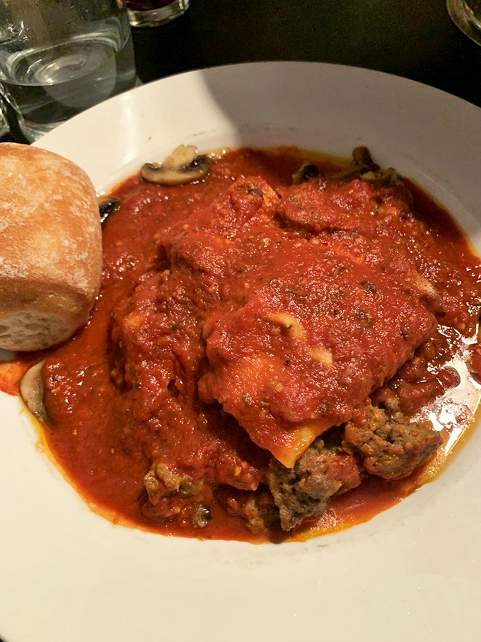 Lasagna that doesn't just sit on the plate—it tells a layered story of tomatoes, cheese, and pasta that's been perfected over generations.