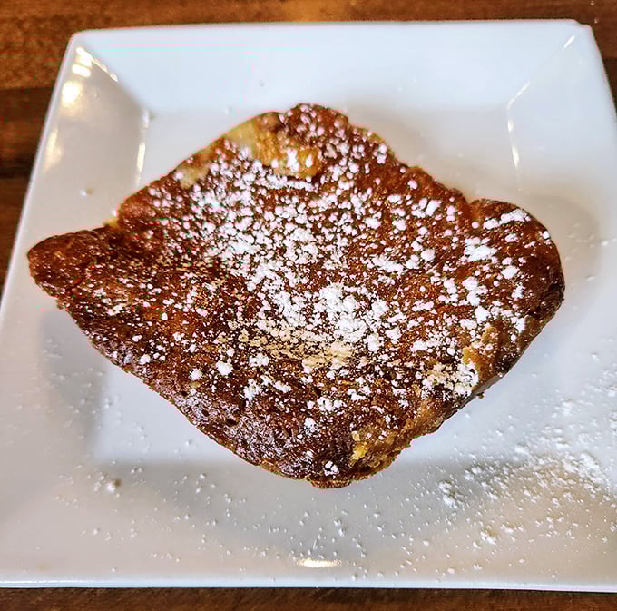 A square of lemon butter cake dusted with powdered sugar—simple, elegant, and guaranteed to make you close your eyes on the first bite.