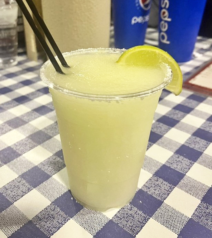Nothing cuts through BBQ richness like this frosty margarita. The lime isn't garnish—it's essential equipment.