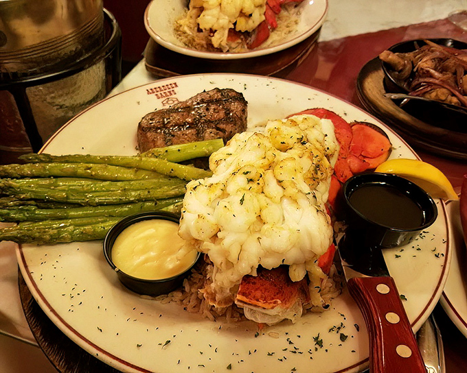 Surf meets turf in this glorious union of land and sea. That lobster tail isn't just seafood—it's a butter-drenched celebration of coastal abundance.