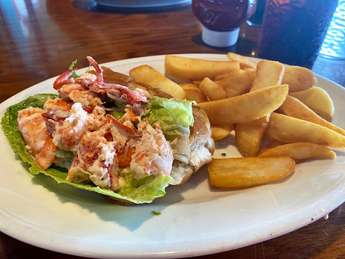 The lobster roll—New England's gift to the world—finds a sunny retirement home in Florida. Sweet meat, buttery roll, zero regrets.