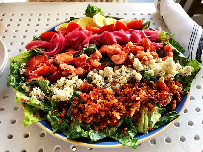 A salad that doesn't apologize for being healthy—because when you top greens with lobster and blue cheese, nobody's complaining.