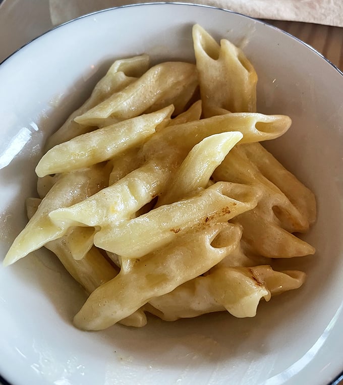 Mac and cheese that's achieved that perfect alchemy of creamy and crispy—the comfort food equivalent of a warm hug.