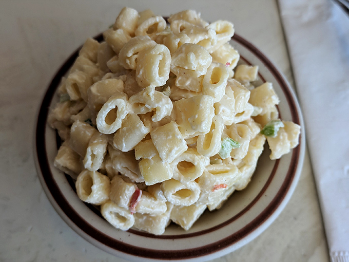 Mac salad that respects the classics—creamy, perfectly cooked pasta with just enough vegetables to make you feel slightly virtuous while indulging.