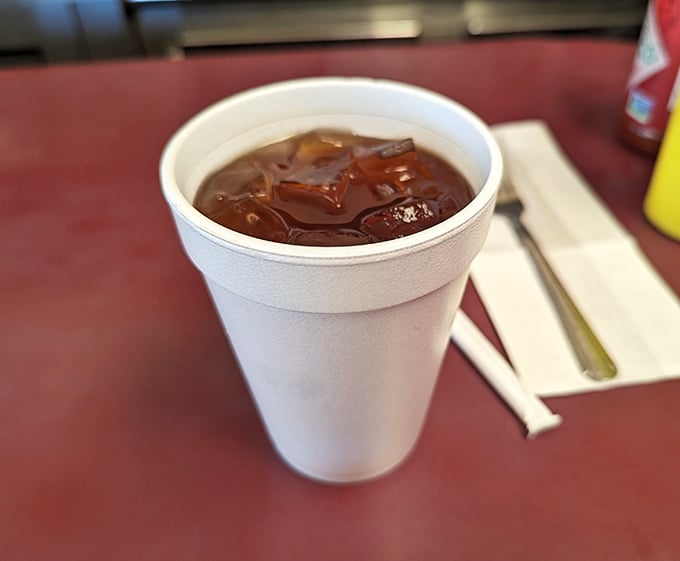 That styrofoam cup might not be Instagram-worthy, but the iced tea inside delivers exactly what you need alongside your burger feast – no filters required.