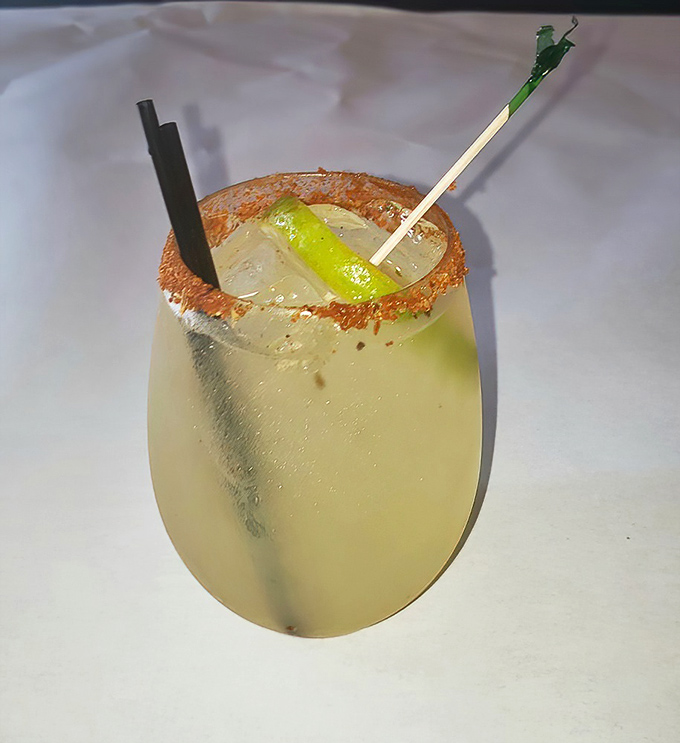 A properly salted rim and a lime wedge – because sometimes your seafood feast deserves a citrusy, tequila-kissed companion.