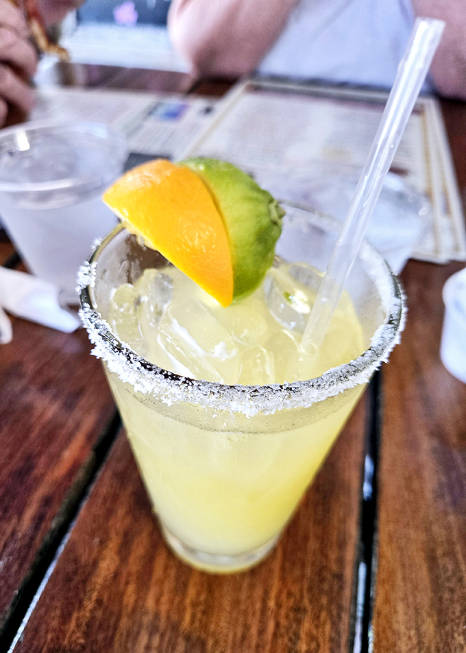 That salt-rimmed glass isn't just holding a margarita – it's containing liquid sunshine with a kick that whispers "vacation mode: activated."