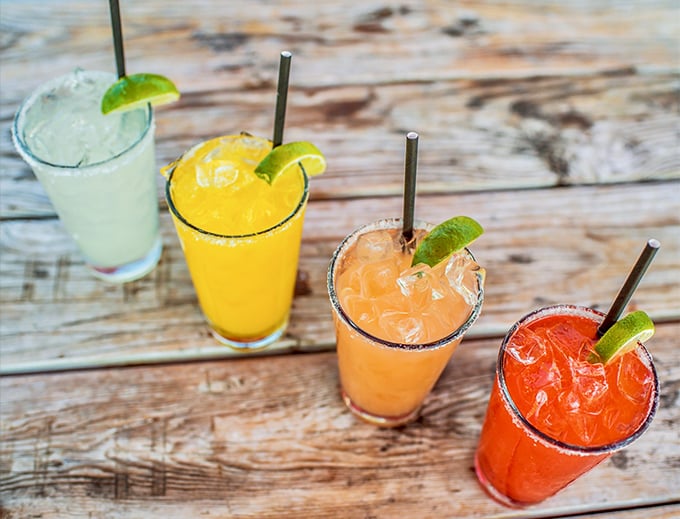 The rainbow of margaritas that says, "Yes, pizza and tequila can be friends." Whoever said you can't drink your dessert never saw these beauties.