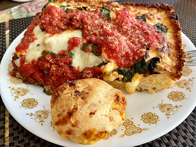 That char on the crust is the pizza equivalent of a perfect tan. The white cheese islands floating in tomato seas create edible artwork.