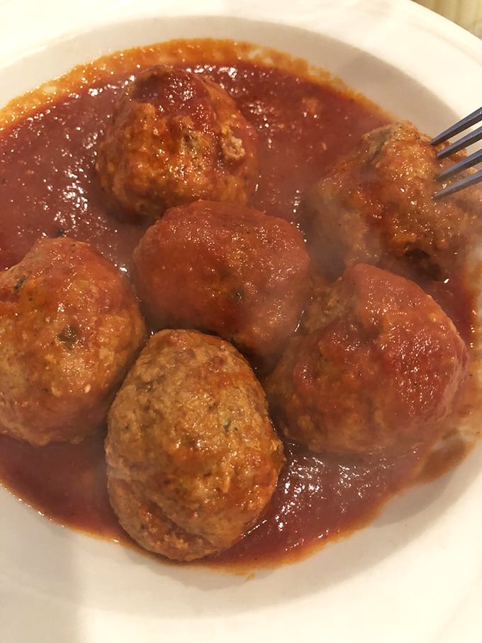Meatballs that deserve their own fan club. These tender spheres of seasoned perfection float in sauce so good you'll be tempted to drink it with a straw.