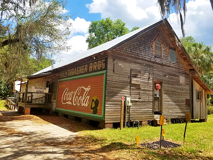 The Thrasher Bros. building wears its Coca-Cola advertisement like an elderly gentleman sporting a vintage concert tee – unexpectedly cool.