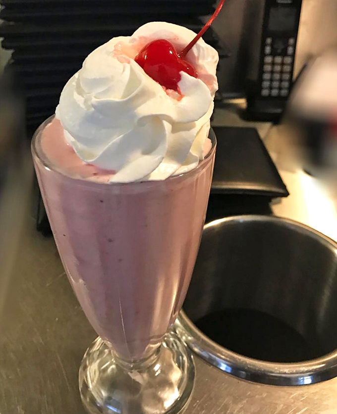 A milkshake topped with enough whipped cream to make your cardiologist wince but your inner child stand up and applaud.