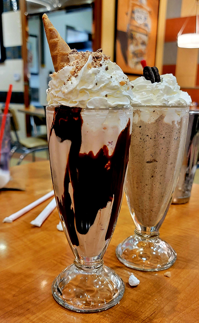 These milkshakes don't just bring boys to the yard—they bring everyone to Richie's. That whipped cream mountain needs its own climbing permit.