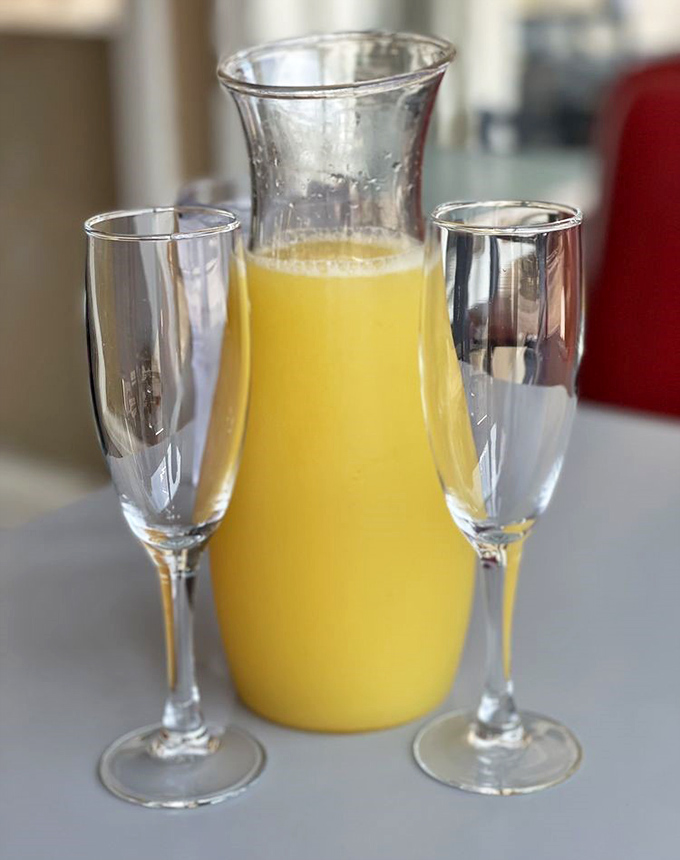Sunshine in a carafe—mimosas await weekend warriors. Nothing says "vacation mode" quite like bubbles before noon.