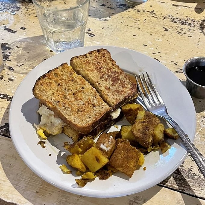 Breakfast that understands you—golden-toasted bread and seasoned potatoes that make morning meetings actually worth attending.