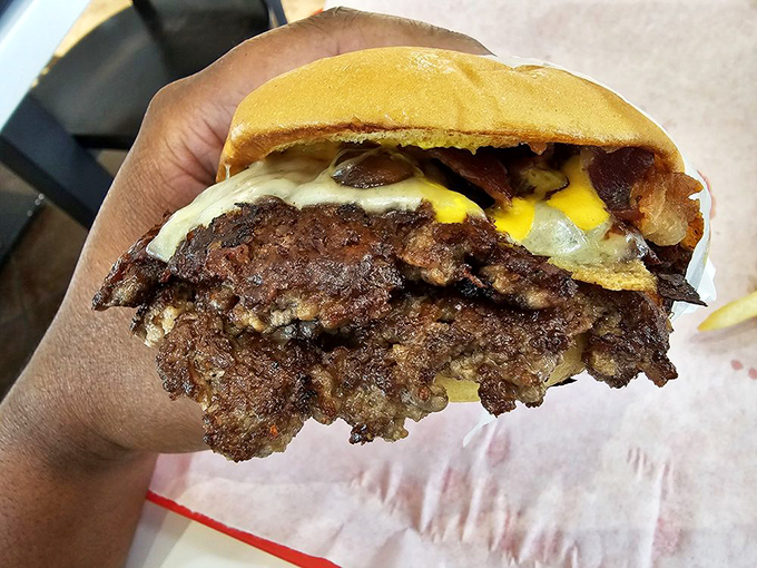 The Mushroom Swiss burger—nature's perfect partnership of earthy mushrooms and nutty Swiss cheese atop a juicy beef canvas.