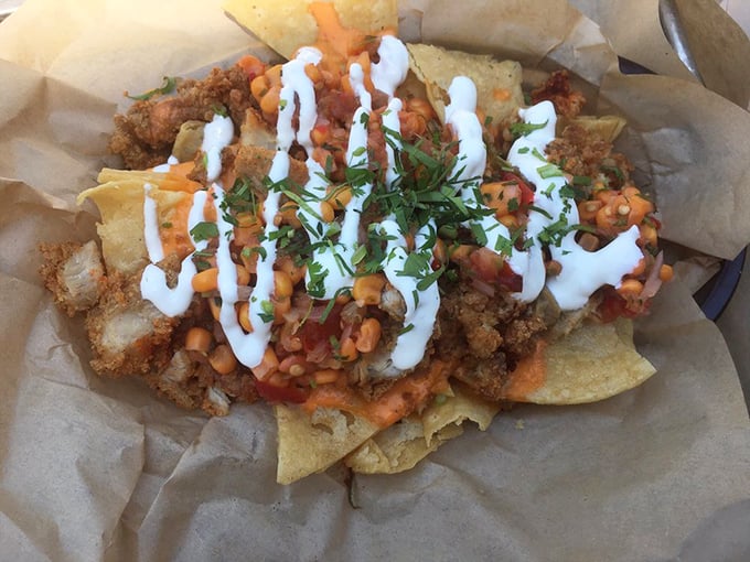 Nachos reimagined with fried chicken – because sometimes traditional boundaries need breaking. A symphony of textures and flavors that defies categorization.