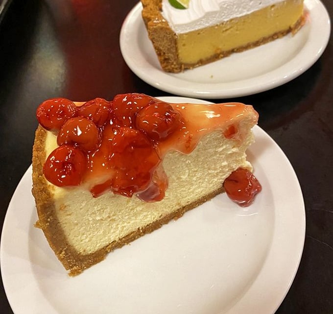 Cheesecake topped with cherry compote—where New York tradition meets Midwestern hospitality on a plate that won't judge you for licking it clean.