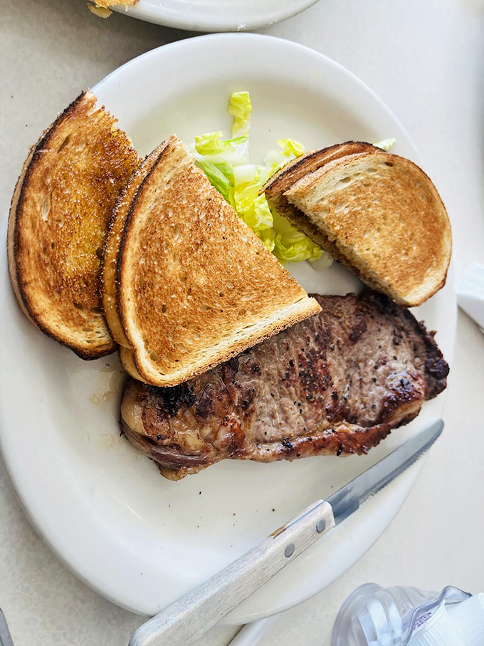 This New York Strip doesn't need fancy presentation—just perfectly grilled beef, golden toast, and zero pretension.