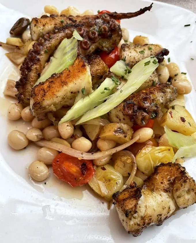 This octopus salad isn't just food—it's Mediterranean poetry on a plate. The beans and vegetables create a perfect supporting cast.
